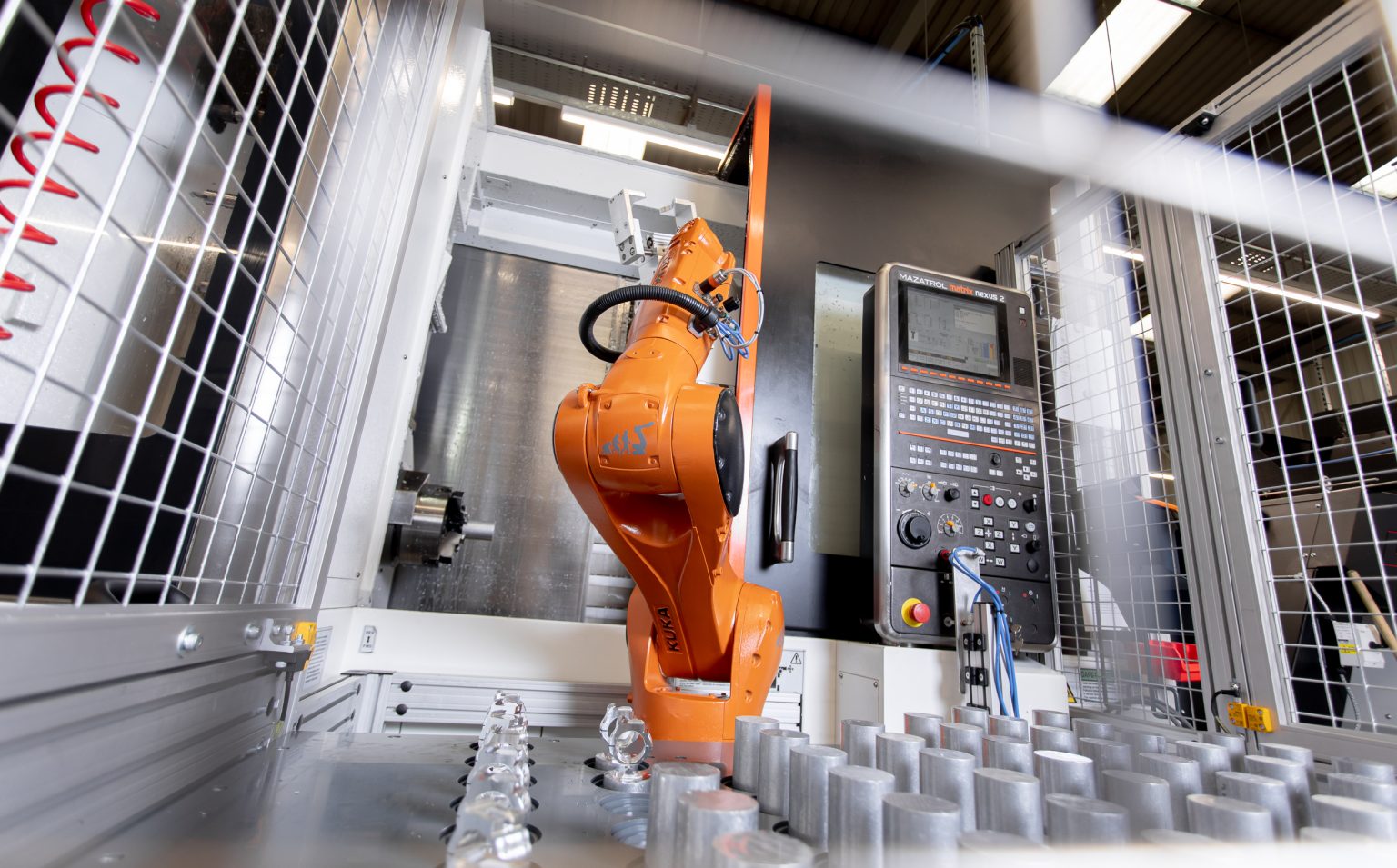 Machine-tending robot for optics | CNC Robotics